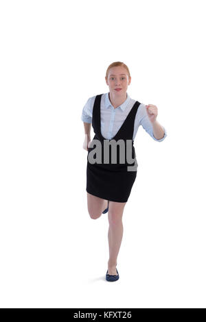 Young female executive gesturing against white background Stock Photo ...