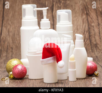 Makeup products and Christmas decorations on color background. Top view ...