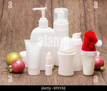 Makeup products and Christmas decorations on color background. Top view ...