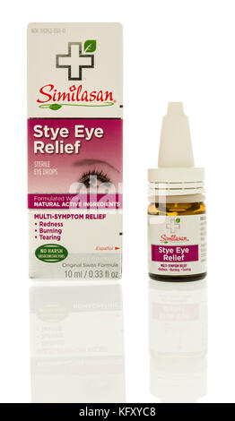 Plastic bottle with eye medication on wooden table Horizontal ...