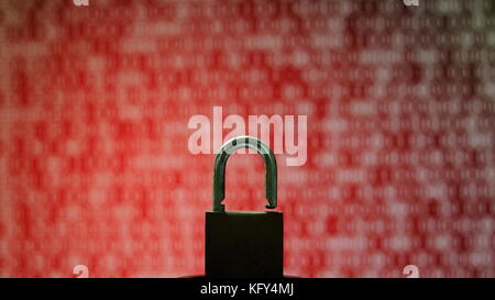 unlock lock in front of ransomware digital screen with numbers and ...