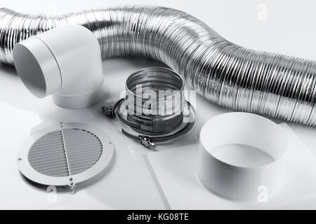White Plastic Pipe Connectors on Wooden Background Stock Photo - Alamy