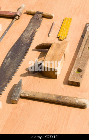 Carpentry tools, saw, spirit level, file, hammer, pencil, spring clamp ...