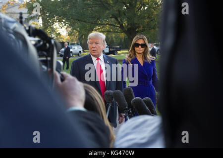 President Donald Trump speaks with reporters alongside Nassau County ...