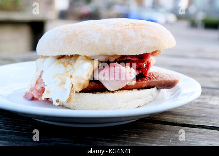 A tasty, mouth watering, breakfast bap made up of Sausage, bacon and ...