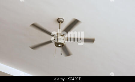 Rotating room ceiling fan Stock Photo - Alamy