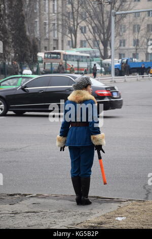 North Korea, Pyongyang, police woman control trafic in a street without ...