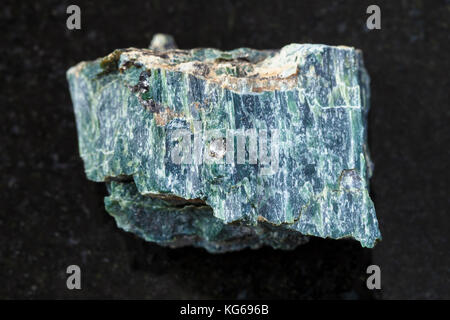 chrysotile asbestos stone on dark background Stock Photo - Alamy