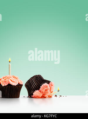 Smashed cupcake on pink background Stock Photo - Alamy