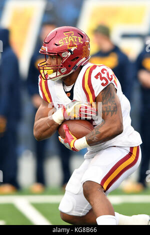 Iowa State running back David Montgomery, front left, runs the ball as ...