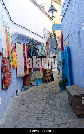 Displayed carpets and rugs in Chefchaouen's medina, Morocco Stock Photo ...