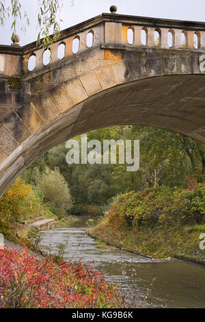Old stone footbridge over creek in the fall with autumn colors Stock ...