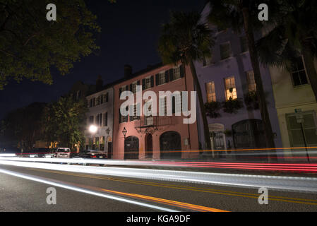 Rainbow row at night with cars going by Stock Photo - Alamy