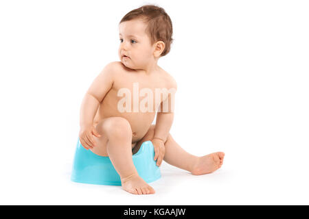 Cute toddler boy, potty training, playing with his teddy bear on potty ...