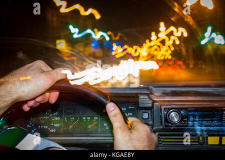 Inside car view POV steering wheel on traffic road with colorful Stock ...