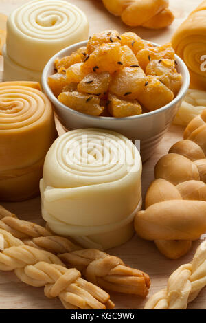 Different traditional smoked and unsmoked Slovakian cheeses on a wooden ...