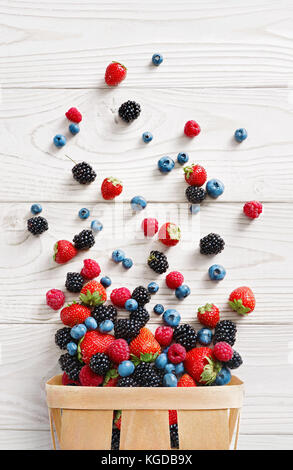 Explosion of different berries. Photo of blueberry, blackberry ...