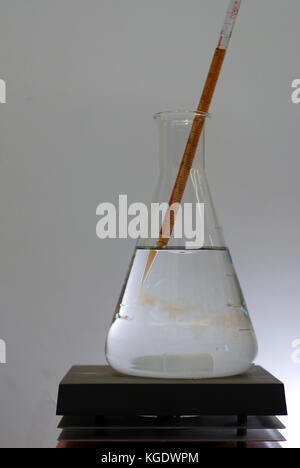 Sampling chemical compounds with a Beaker and Pipette Stock Photo - Alamy