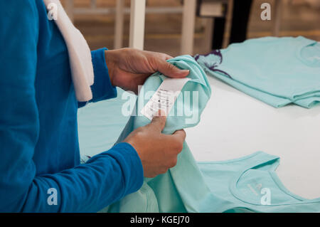 at a garment factory quality control check for defects Stock Photo - Alamy