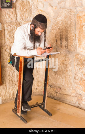 Israel Jerusalem Old City bearded Orthodox Jew sitting by lectern ...