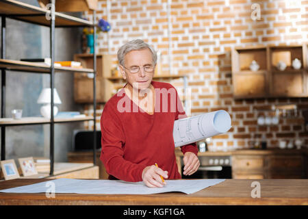 Intelligent smart man doing the drawing Stock Photo - Alamy