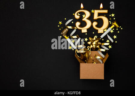 Birthday celebration number 35 candle with gold and silver balloons ...