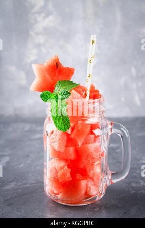 Pieces of refreshing watermelon on a dark wood background. Close-up ...