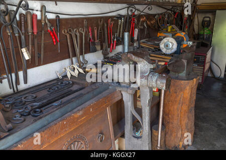 Tools and workbench in a traditional ironmongery workshop Stock Photo ...