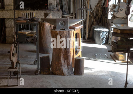 Tools and workbench in a traditional ironmongery workshop Stock Photo ...