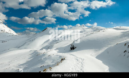 sunset over mountains with snow and shadows Stock Photo - Alamy