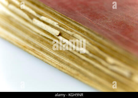 Old antique worn book with worn bent page edges and red stained cover ...