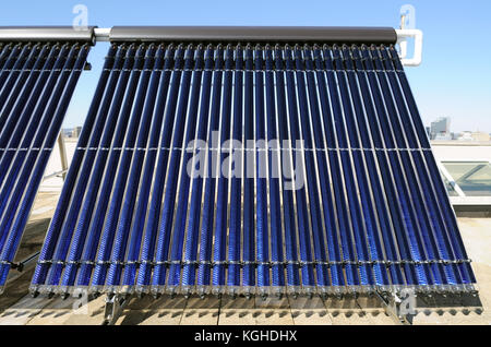 A solar thermal panel, evacuated tube, OPC 15, mounted on the wall of a ...