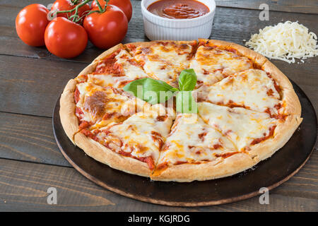Fresh and hot pizza on the table Stock Photo - Alamy