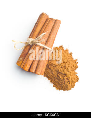 Bunch of cinnamon sticks on a white reflective background. Selective ...