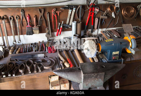 Tools and workbench in a traditional ironmongery workshop Stock Photo ...