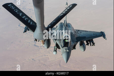 A French Air Force Rafale conducts refueling operations with a KC-135 ...
