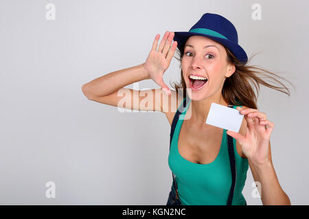 Beautiful stylish girl holding pass ticket Stock Photo - Alamy