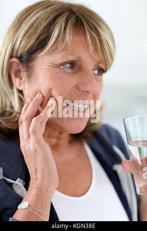 Closeup of senior woman having her teeth examined by a successful ...