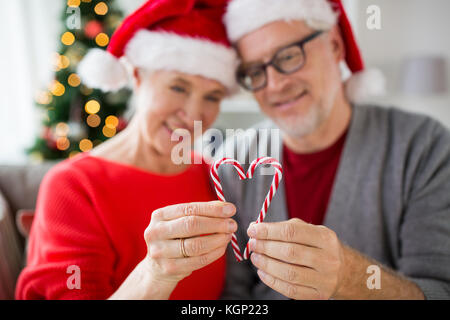 senior couple with heart of christmas candy canes Stock Photo - Alamy