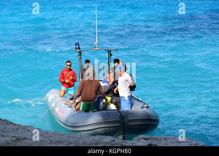 A small inflatable Vigilanza boat on blue sea water in Sardinia, Italy ...