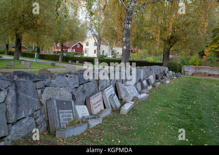 GRAVESTONES from completed graves have been set against the cementery ...
