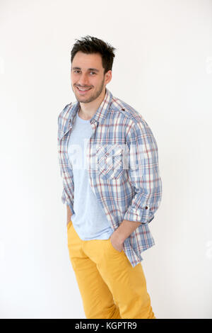 Trendy guy standing on white background Stock Photo - Alamy