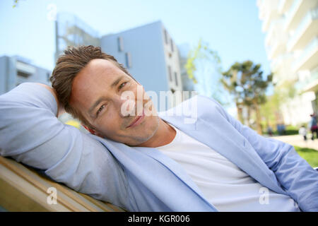 Handsome 40-year-old man relaxing in sofa Stock Photo: 165190786 - Alamy