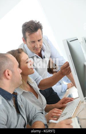 Group of students attending training course at school Stock Photo - Alamy
