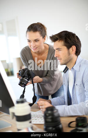 Team of photo reporters working in office Stock Photo - Alamy