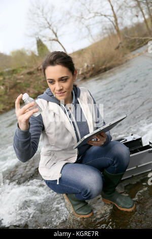 Student in biology taking sample of natural water Stock Photo - Alamy