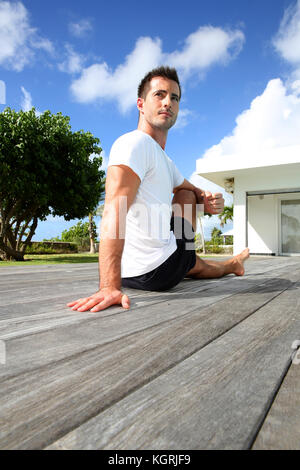 Man doing exercises by the pool Stock Photo - Alamy