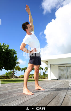 Man doing exercises by the pool Stock Photo - Alamy