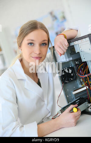 Student girl in technology fixug computer hard drive Stock Photo - Alamy