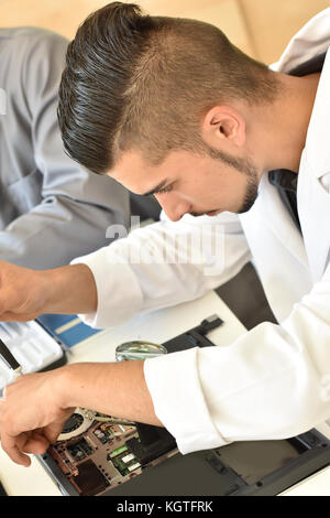 student in technology fixing computer processing Stock Photo - Alamy